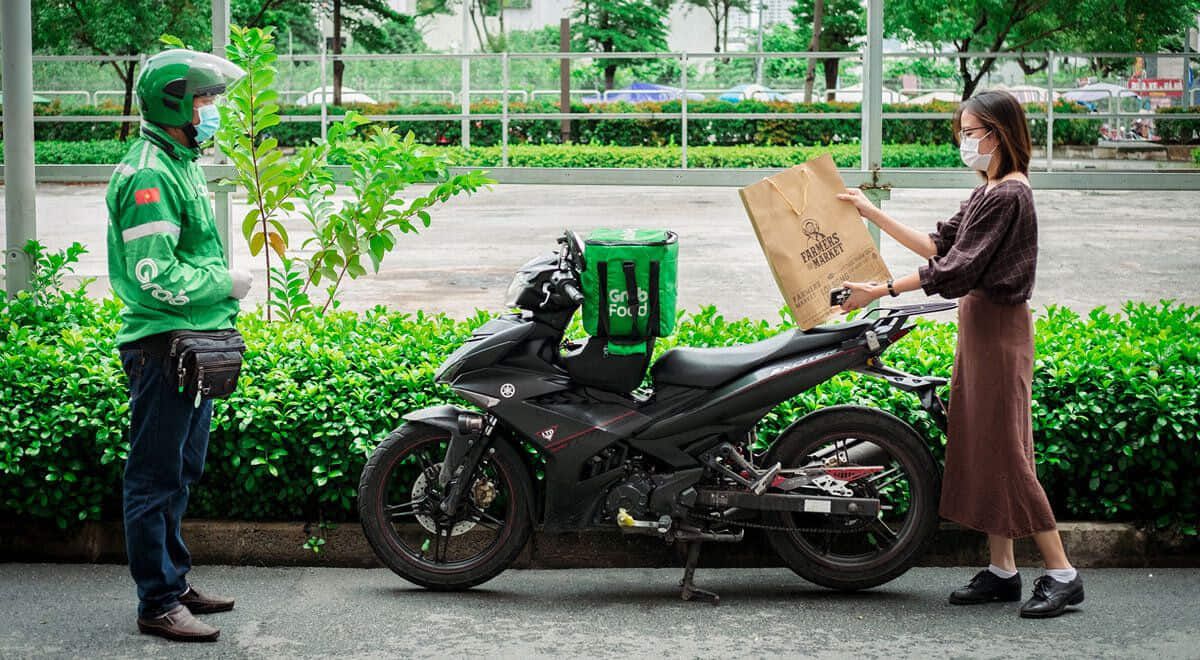 Grab touts food and grocery deliveries as ride-hailing slows